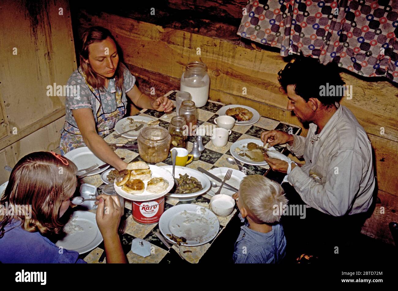1940s family eating dinner in their dugout home New Mexico Oct. 1940 ...