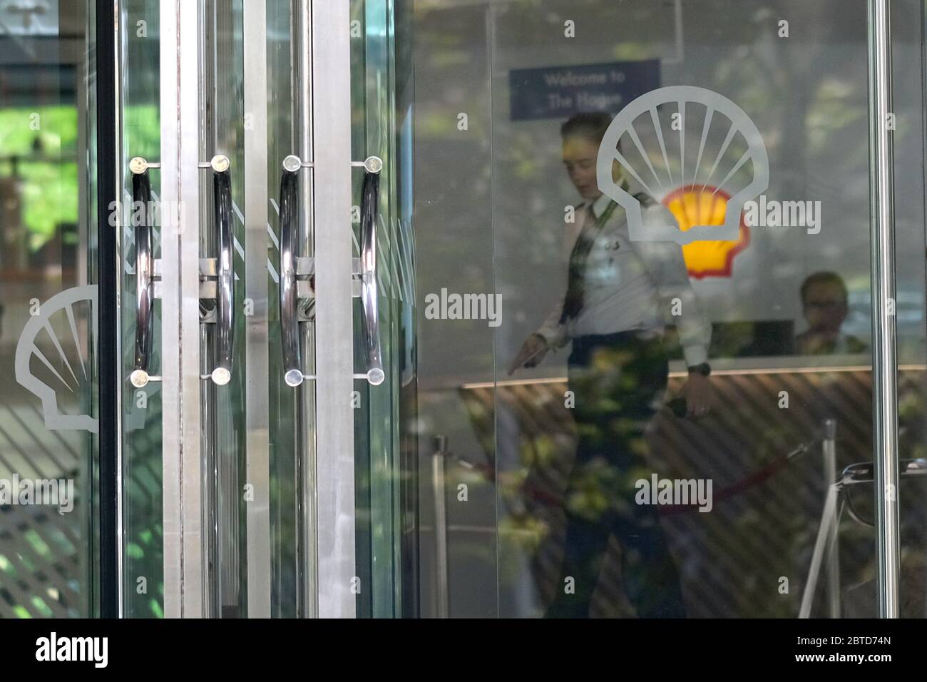 A security personnel is seen past a logo of Royal Dutch Shell Plc at ...