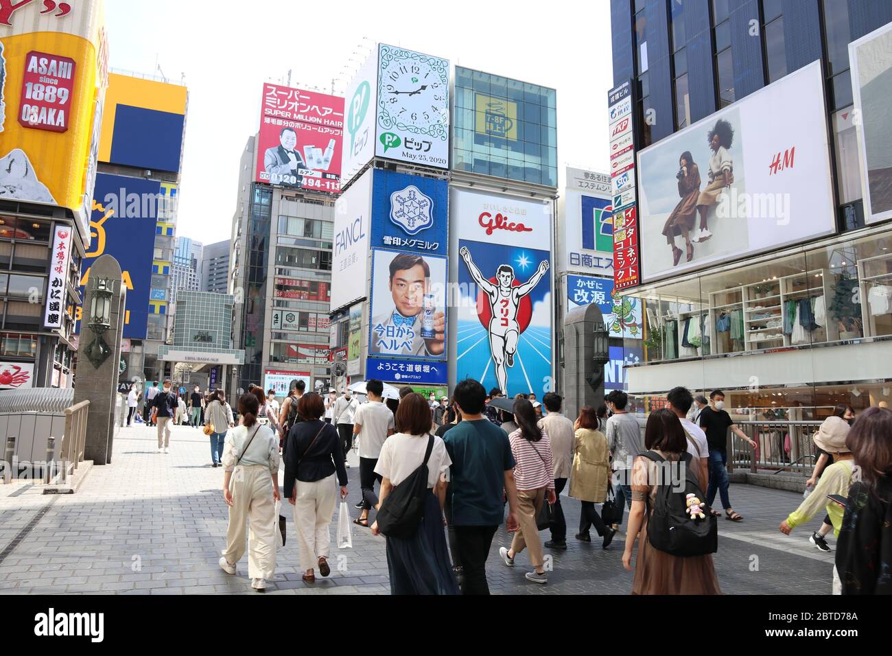 People wearing face masks walk in Osaka, Japan on May 23, 2020, on the ...