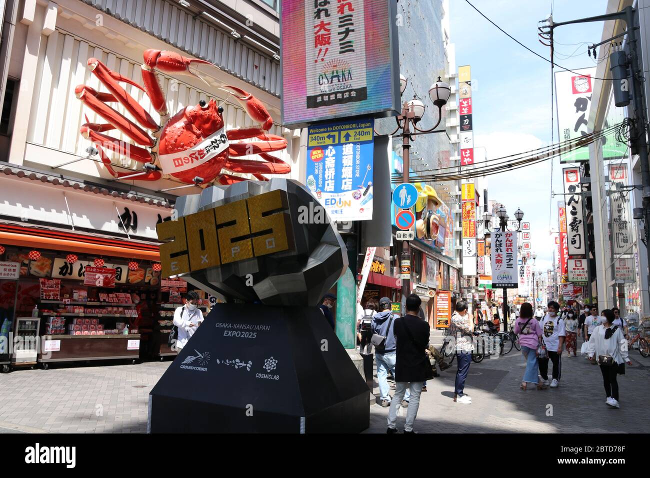 People wearing face masks walk in Osaka, Japan on May 23, 2020, on the ...