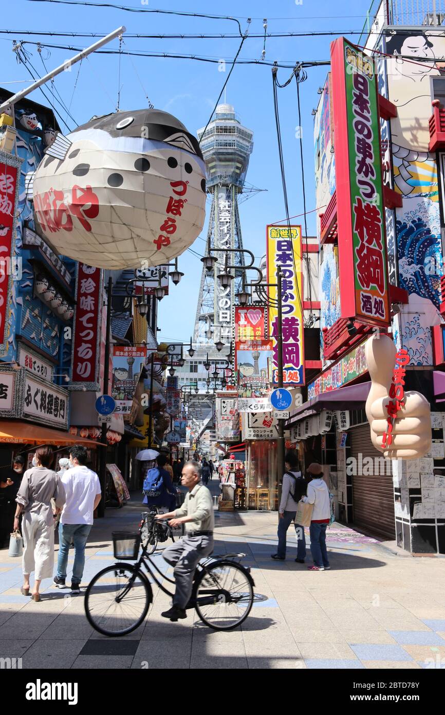 People wearing face masks walk in Osaka, Japan on May 23, 2020, on the ...
