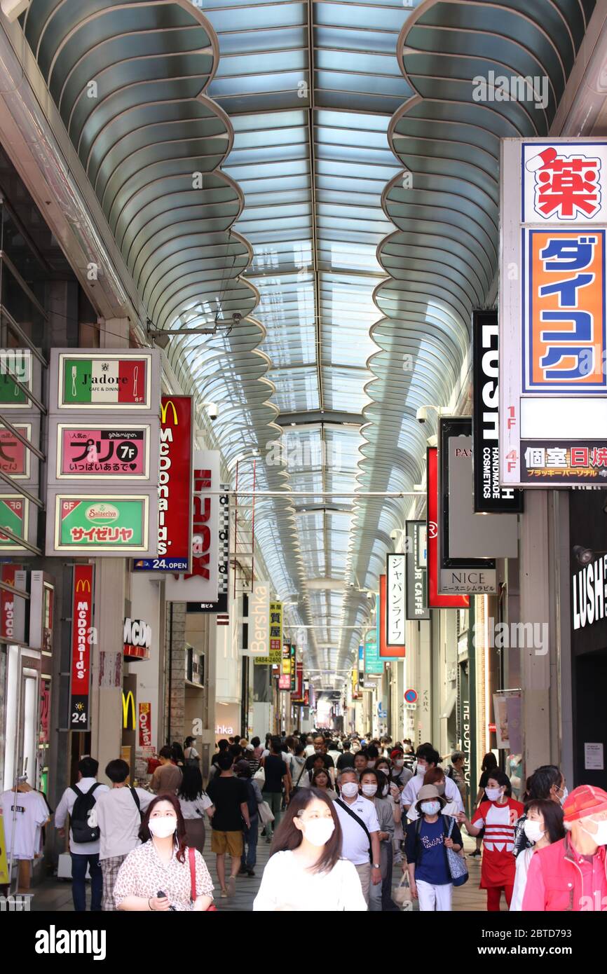 People wearing face masks walk in Osaka, Japan on May 23, 2020, on the ...