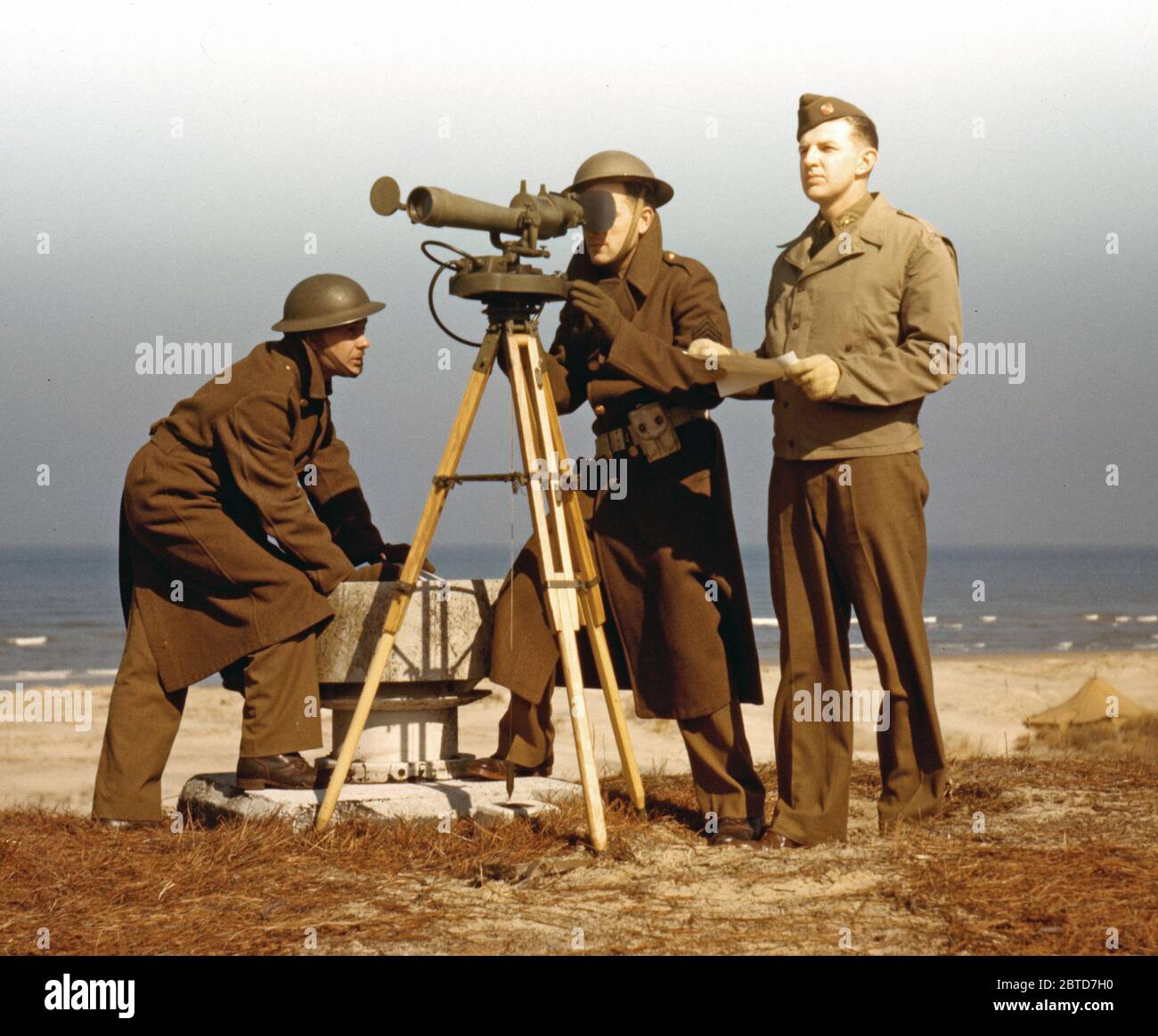 Men of Fort Story operate an azimuth instrument, to measure the angle ...