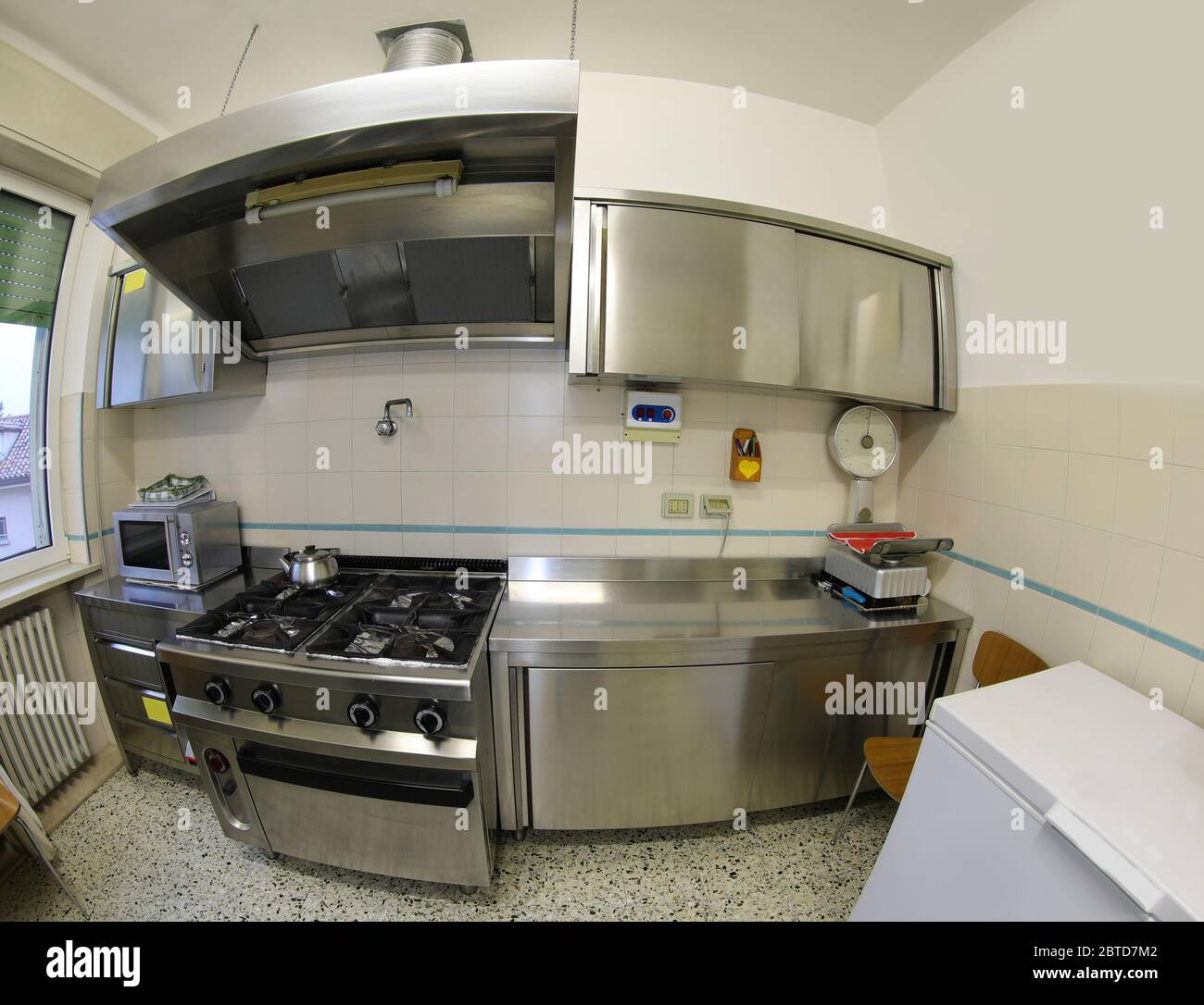 industrial kitchen photographed with fisheye lens without the cooks ...
