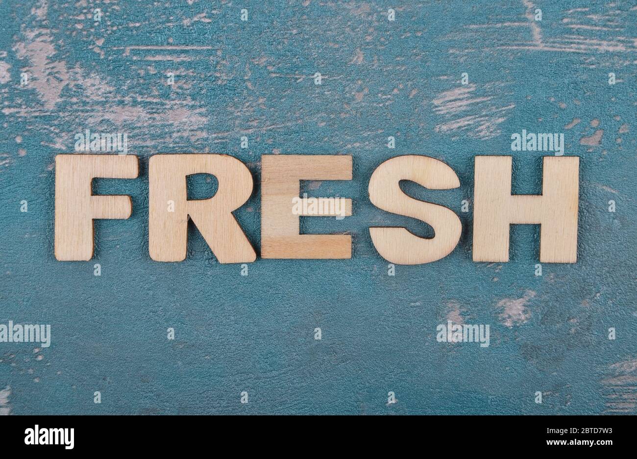 Term from wooden letters on weathered concrete Stock Photo - Alamy