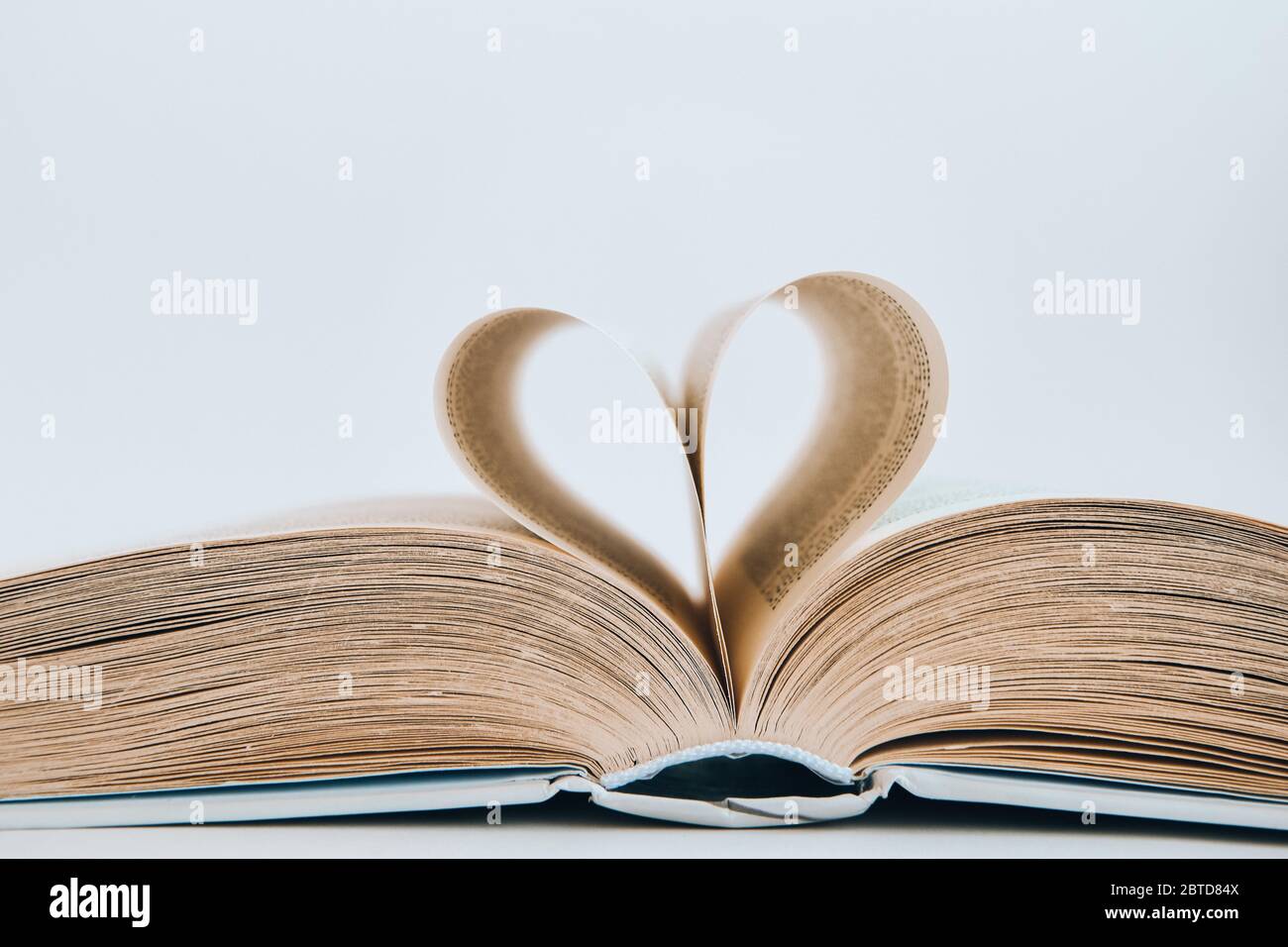 Book with love symbol isolated on white background, Close-up Of Heart ...