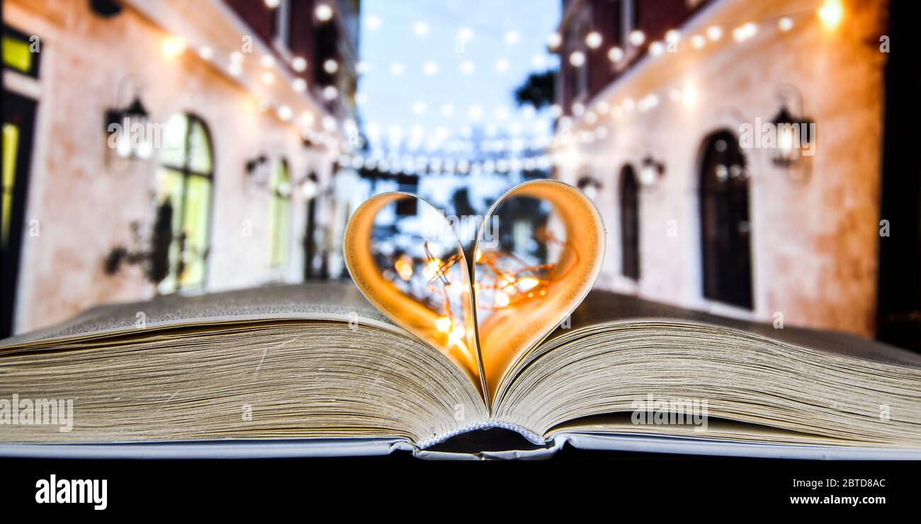 Book with love symbol isolated on cafe street background, Close-up Of ...