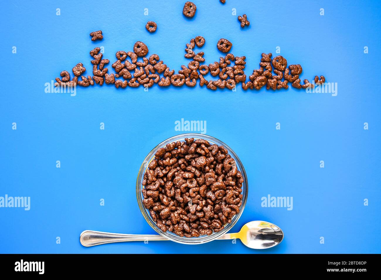 Chocolate cornflakes in the shape of letters of the English alphabet ...