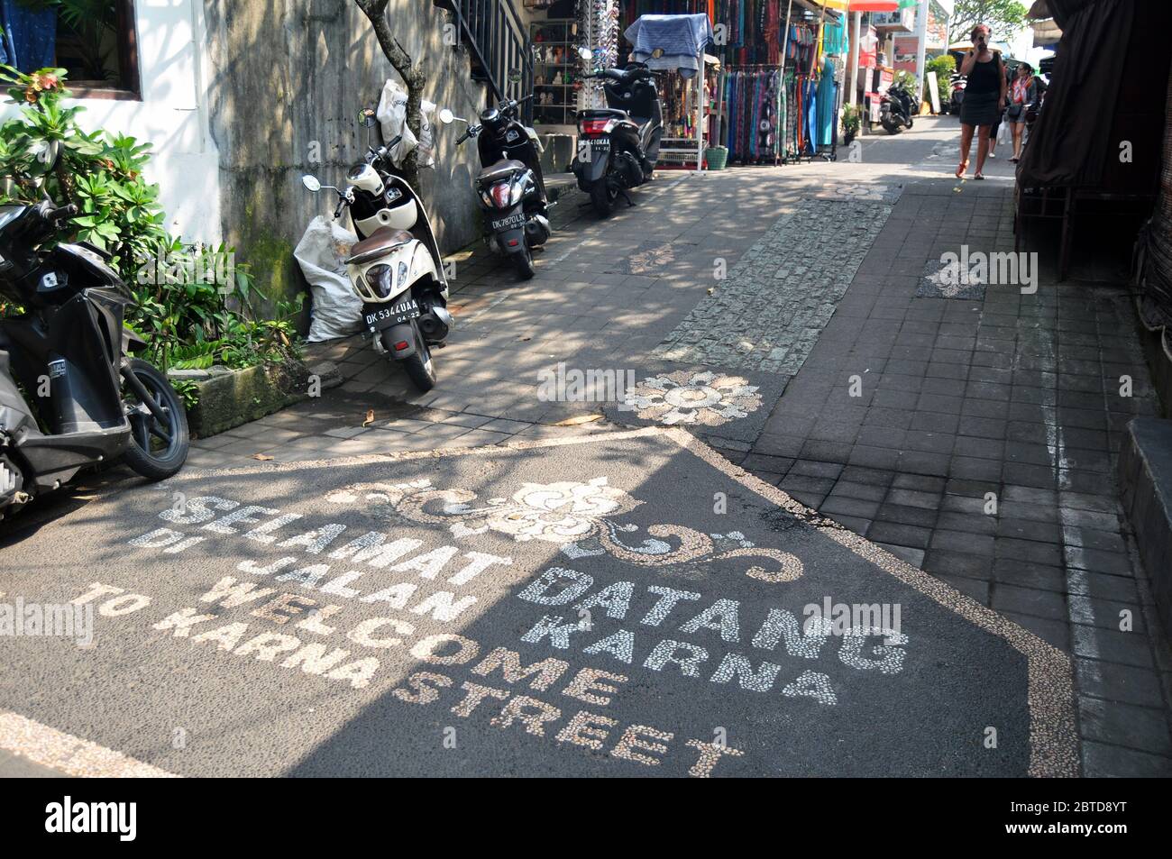 BALI, INDONESIA - MARCH 23 : Small road in narrow alley for balinese ...