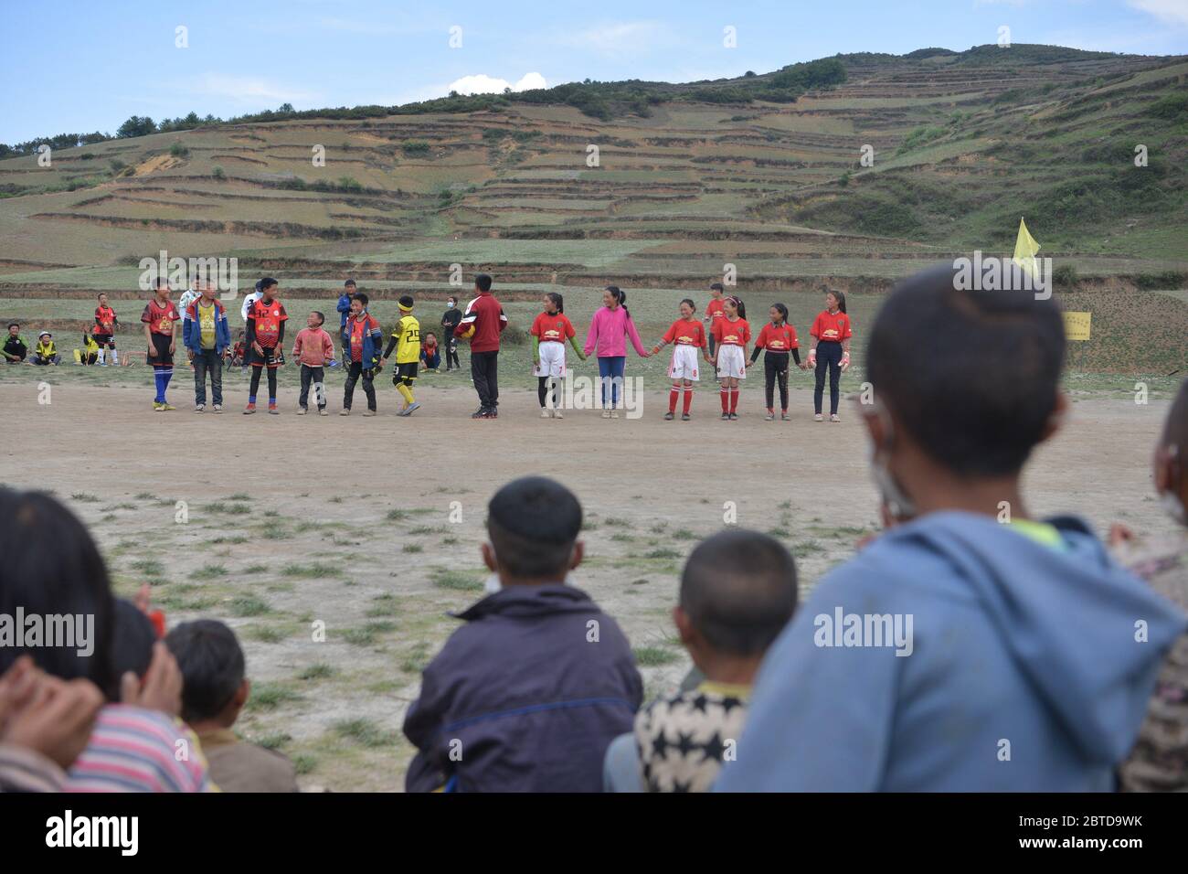 Children playing football in mud hi-res stock photography and images ...
