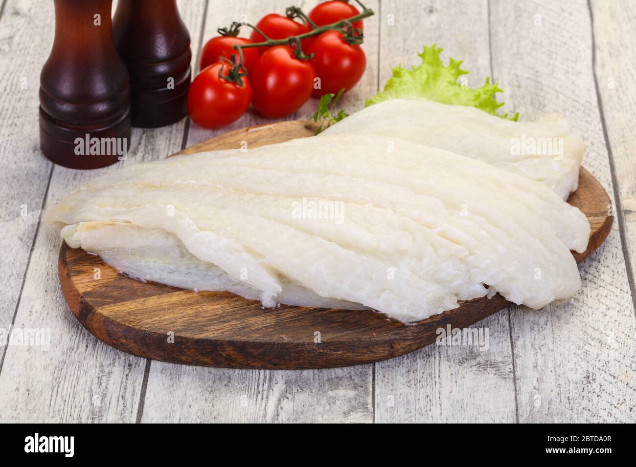 Raw halibut fillet ready for cooking Stock Photo - Alamy