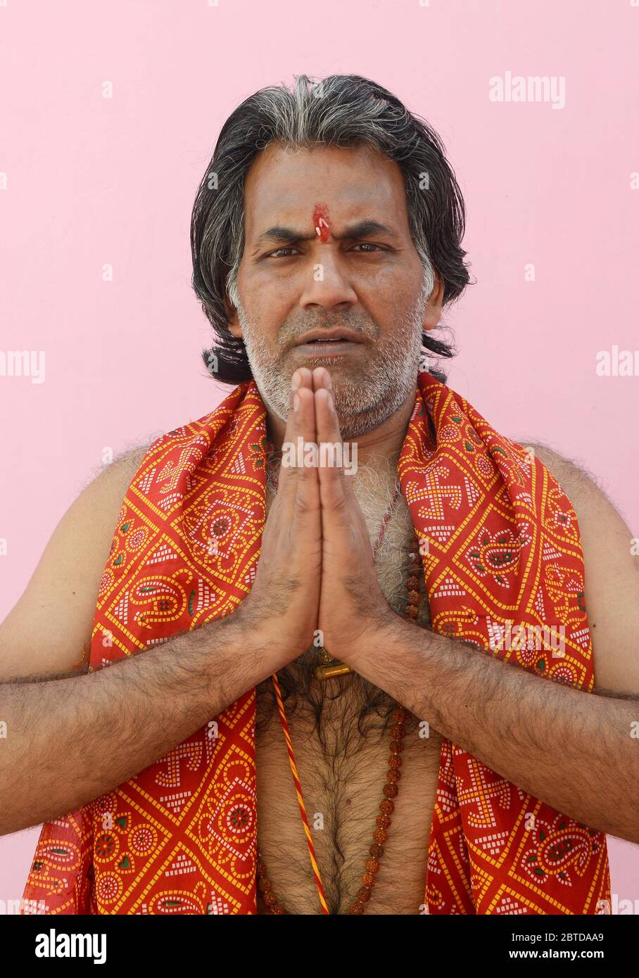 Young Indian Priest greeting Stock Photo - Alamy