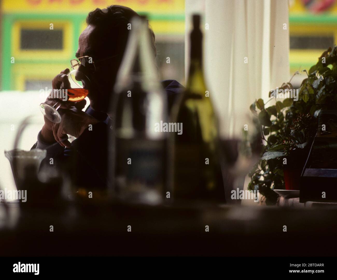 Frenchman drinking wine Stock Photo - Alamy