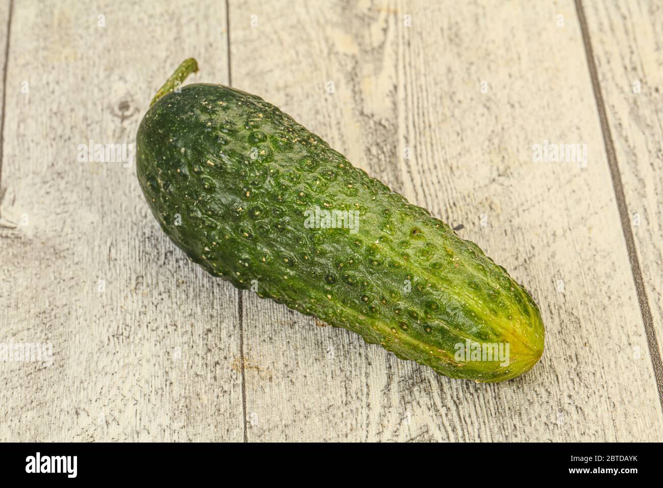 Green ripe fresh one cucumber over background Stock Photo - Alamy