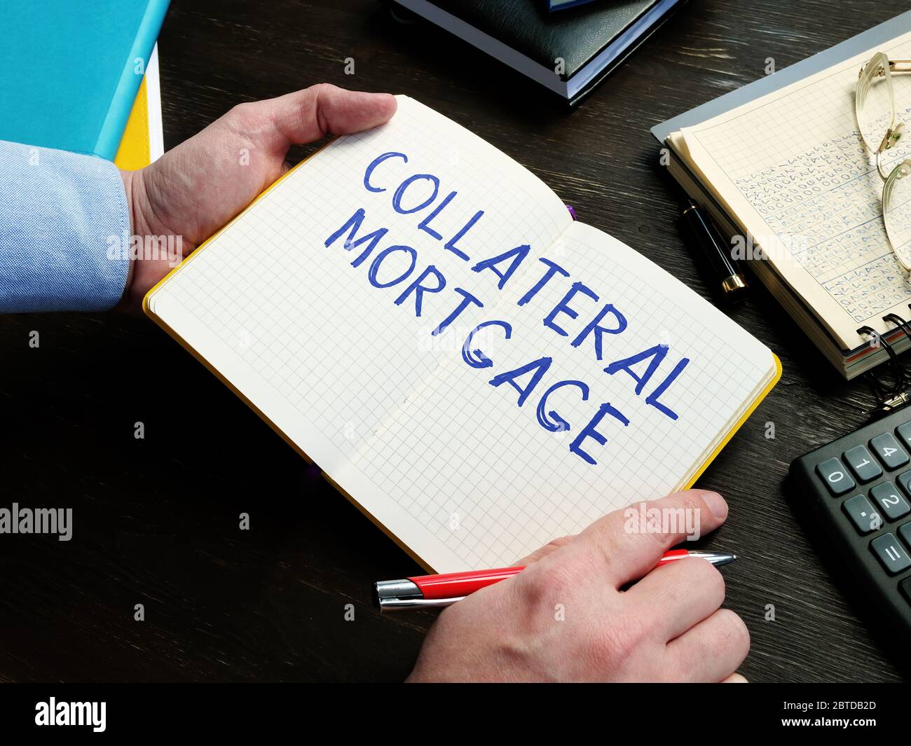 Man writes Collateral Mortgage sign on the sheet Stock Photo - Alamy