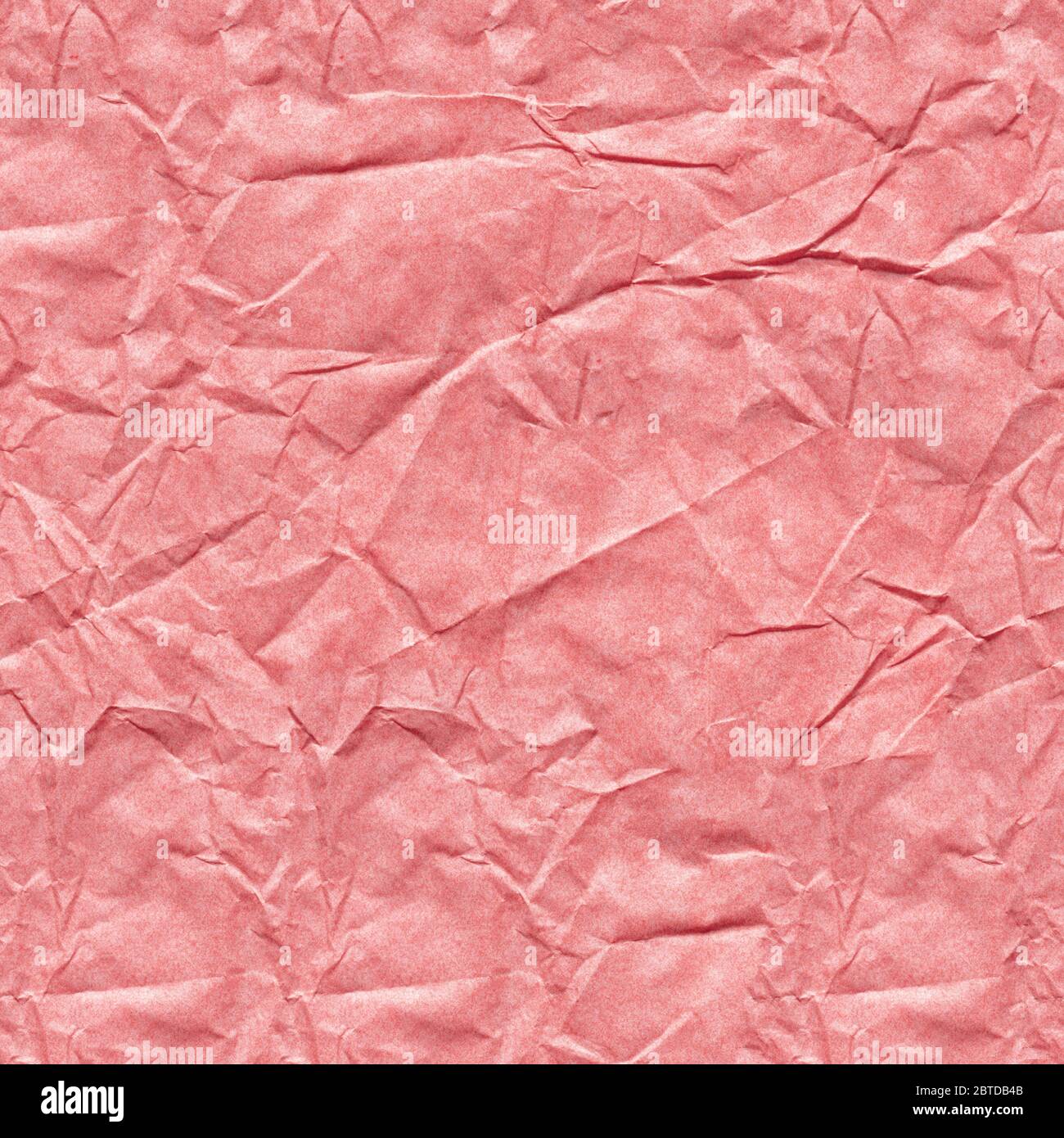 Crumpled paper background in pink color as part of your greeting gift ...