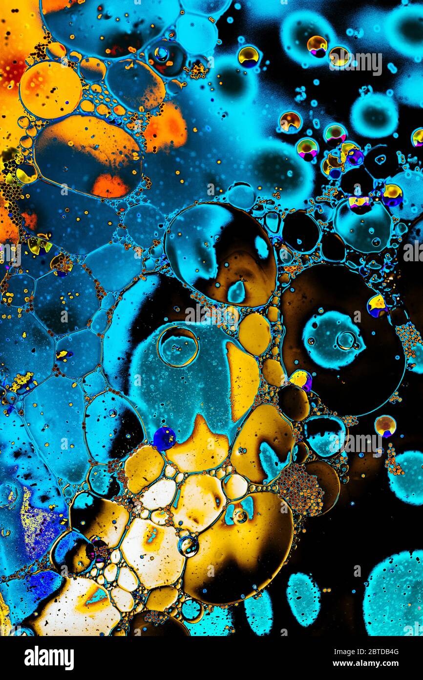 Oil bubbles inside water base form patterns Stock Photo - Alamy