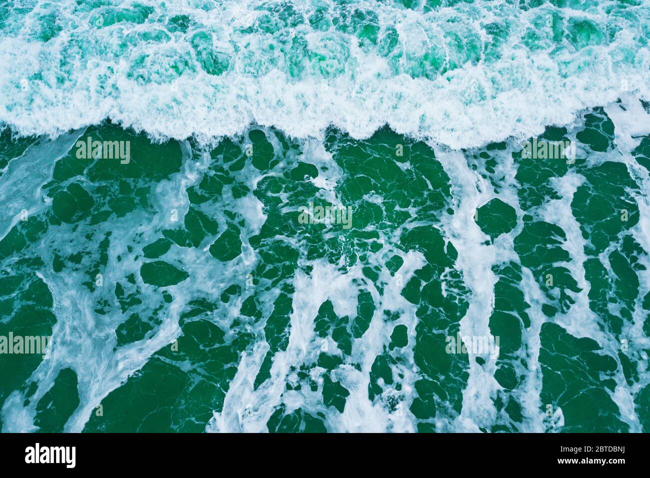 Texture of ocean wave. Sunrise shot Stock Photo - Alamy