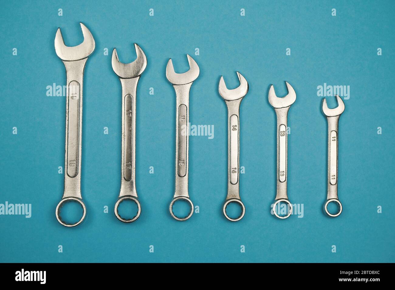 Wrenches on the blue background. Studio shot, top view Stock Photo - Alamy