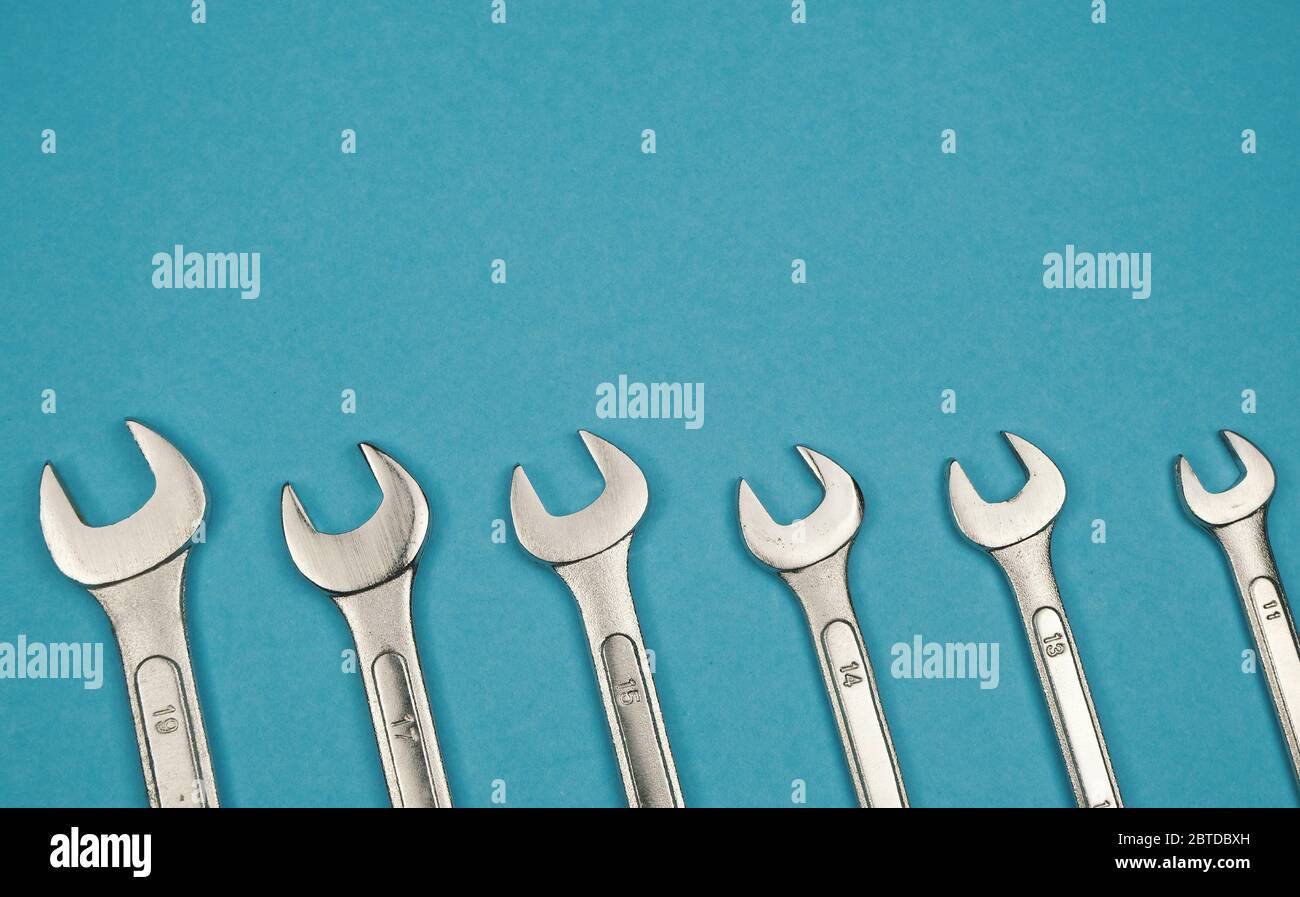 Wrenches on the blue background. Studio shot, top view Stock Photo - Alamy