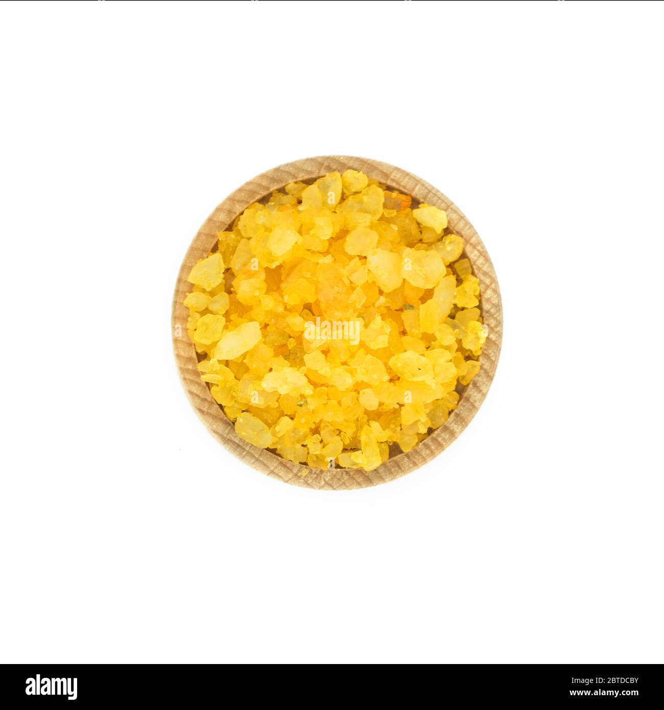 Yellow sea spa salt in wood bowl isolated on white background Stock ...