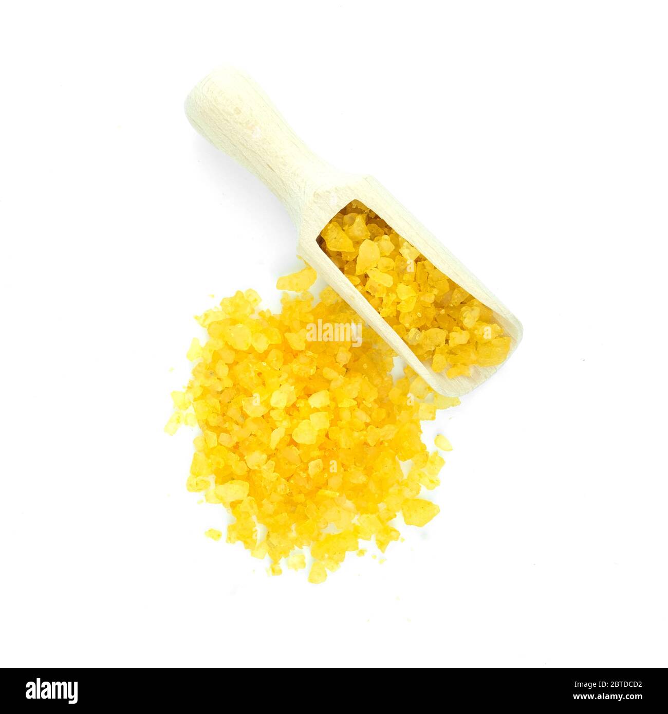 Yellow sea spa salt with wood scoop isolated on white background Stock ...