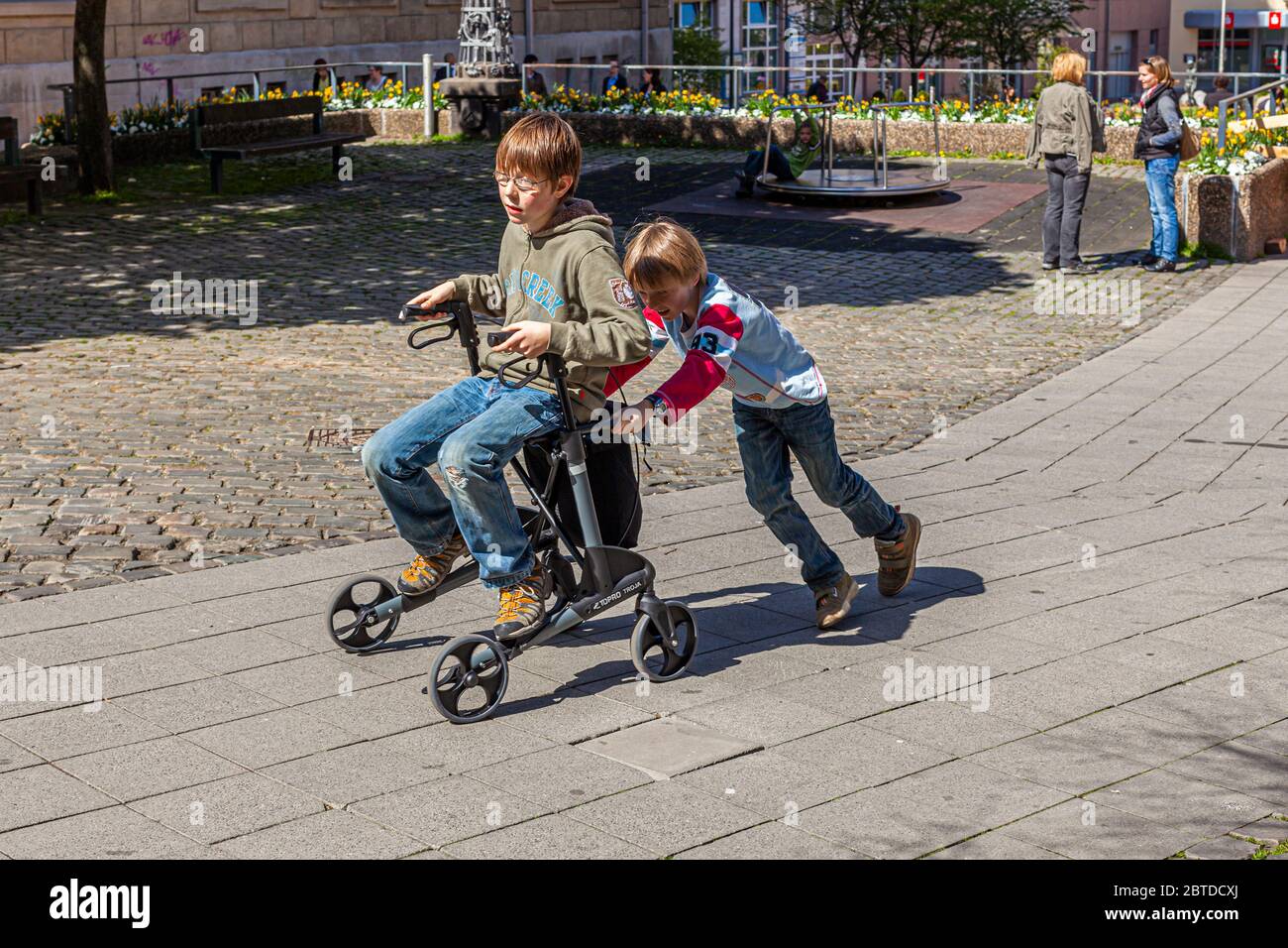 Grandson is playing with Grandmother's Rollator in Aachen, Germany ...
