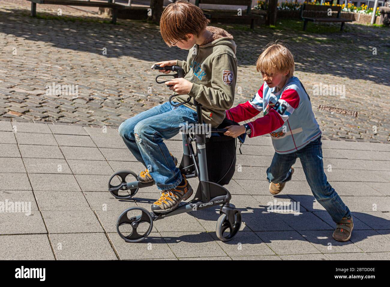 Grandson is playing with Grandmother's Rollator in Aachen, Germany ...