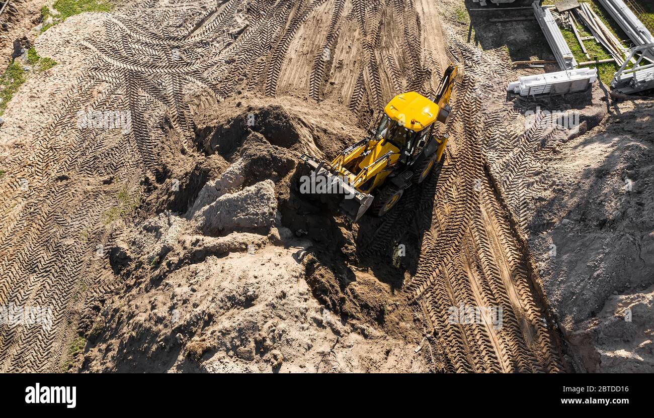excavator working on a construction site top view Stock Photo - Alamy
