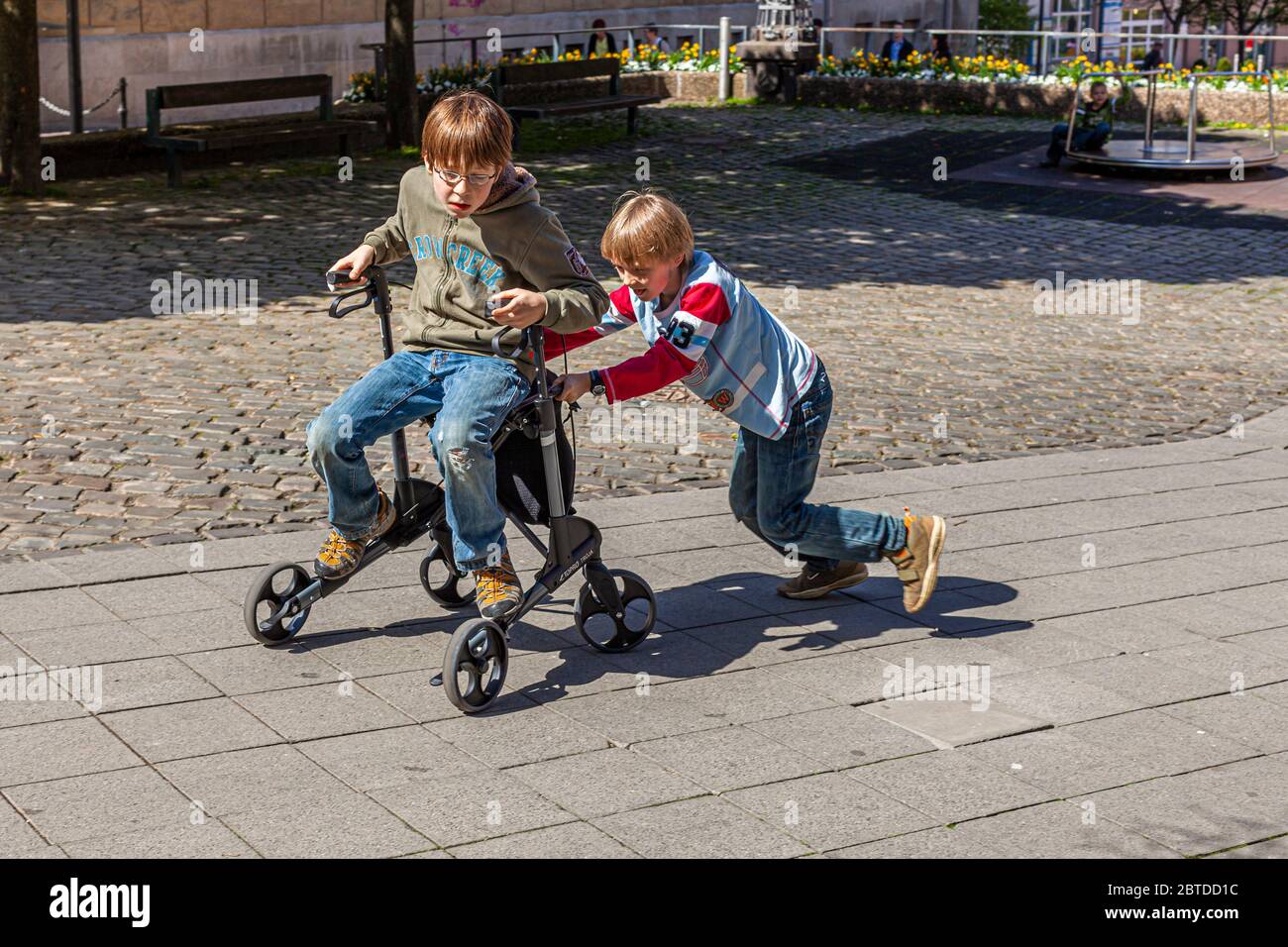 Grandson is playing with Grandmother's Rollator in Aachen, Germany ...