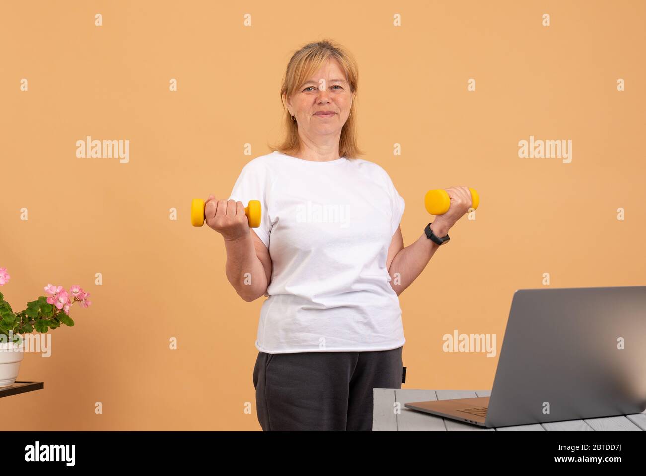Fitness workout and working on laptop computer - woman multitasking ...