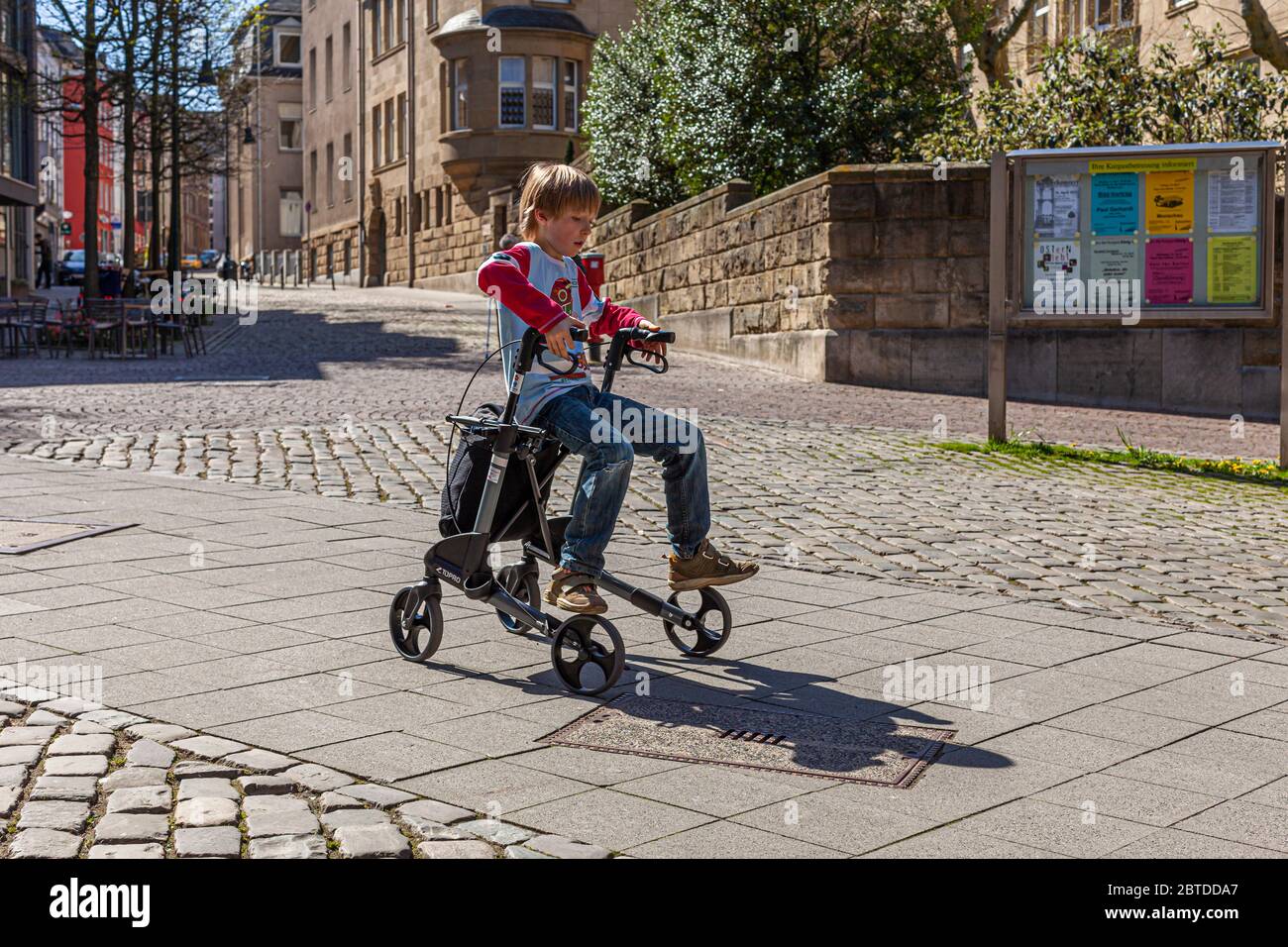 Grandson is playing with Grandmother's Rollator in Aachen, Germany ...