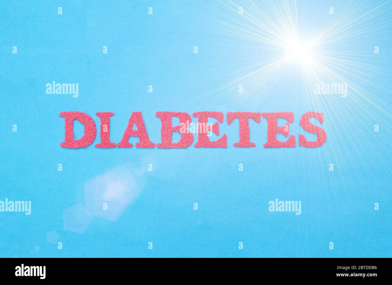 Word diabetes in red letters on a blue background. The concept of ...