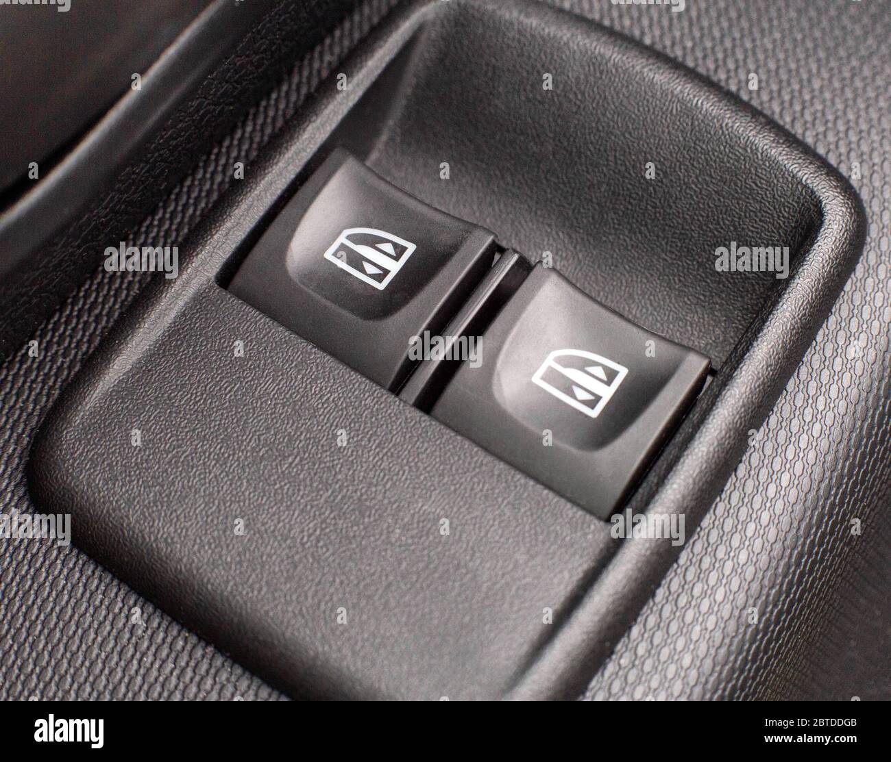 Two front and rear power windows control buttons in a modern car ...