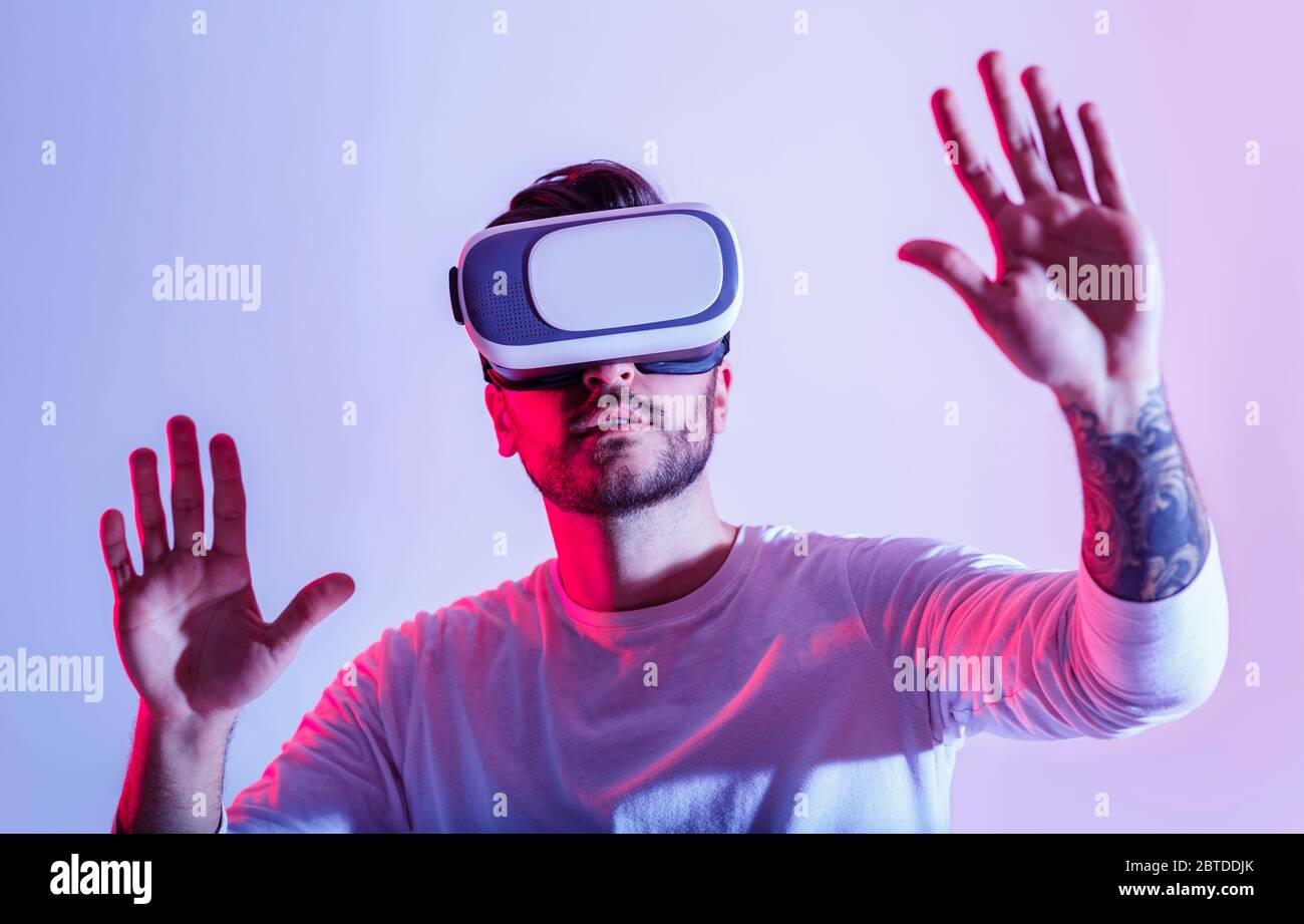 Modern digital entertainment. Man uses virtual glasses Stock Photo - Alamy