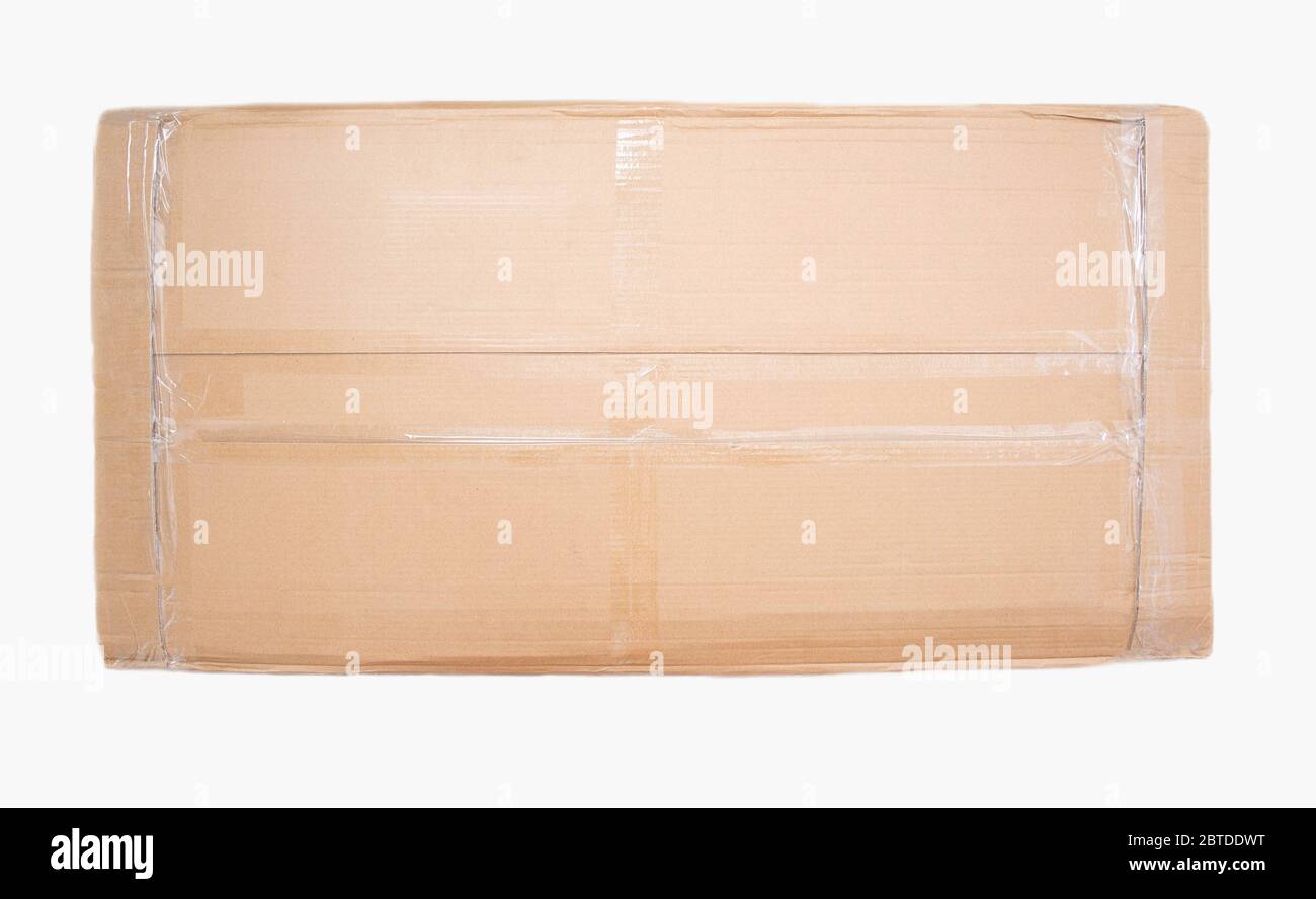 cardboard box in which new furniture is packed on a white background ...