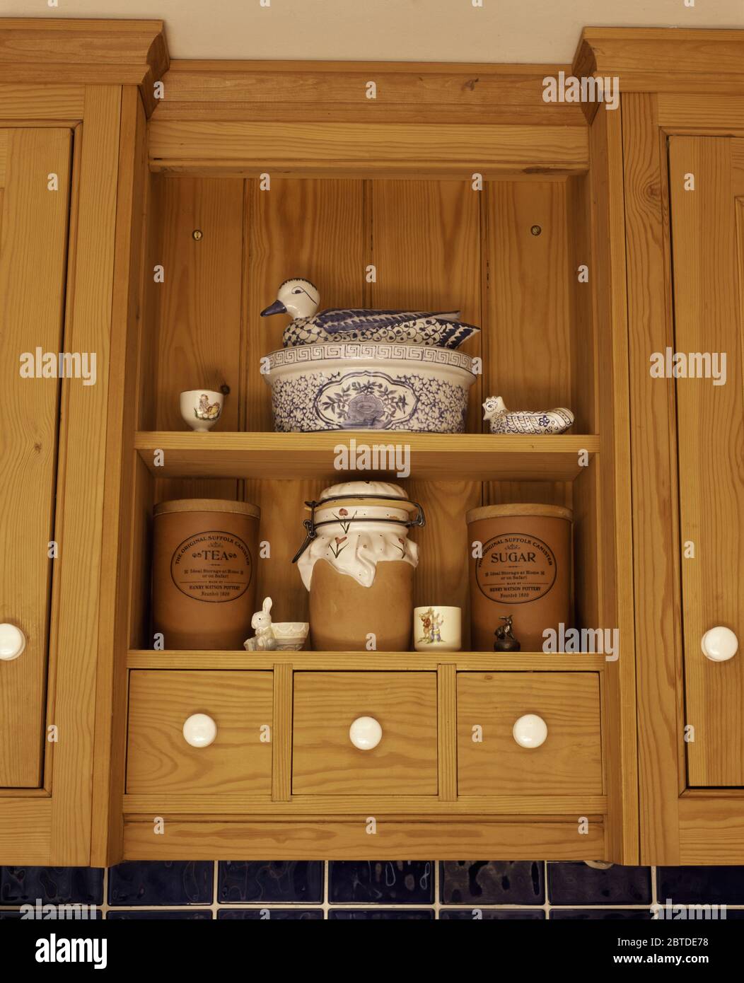 Terracotta storage jars on kitchen cupboard Stock Photo - Alamy