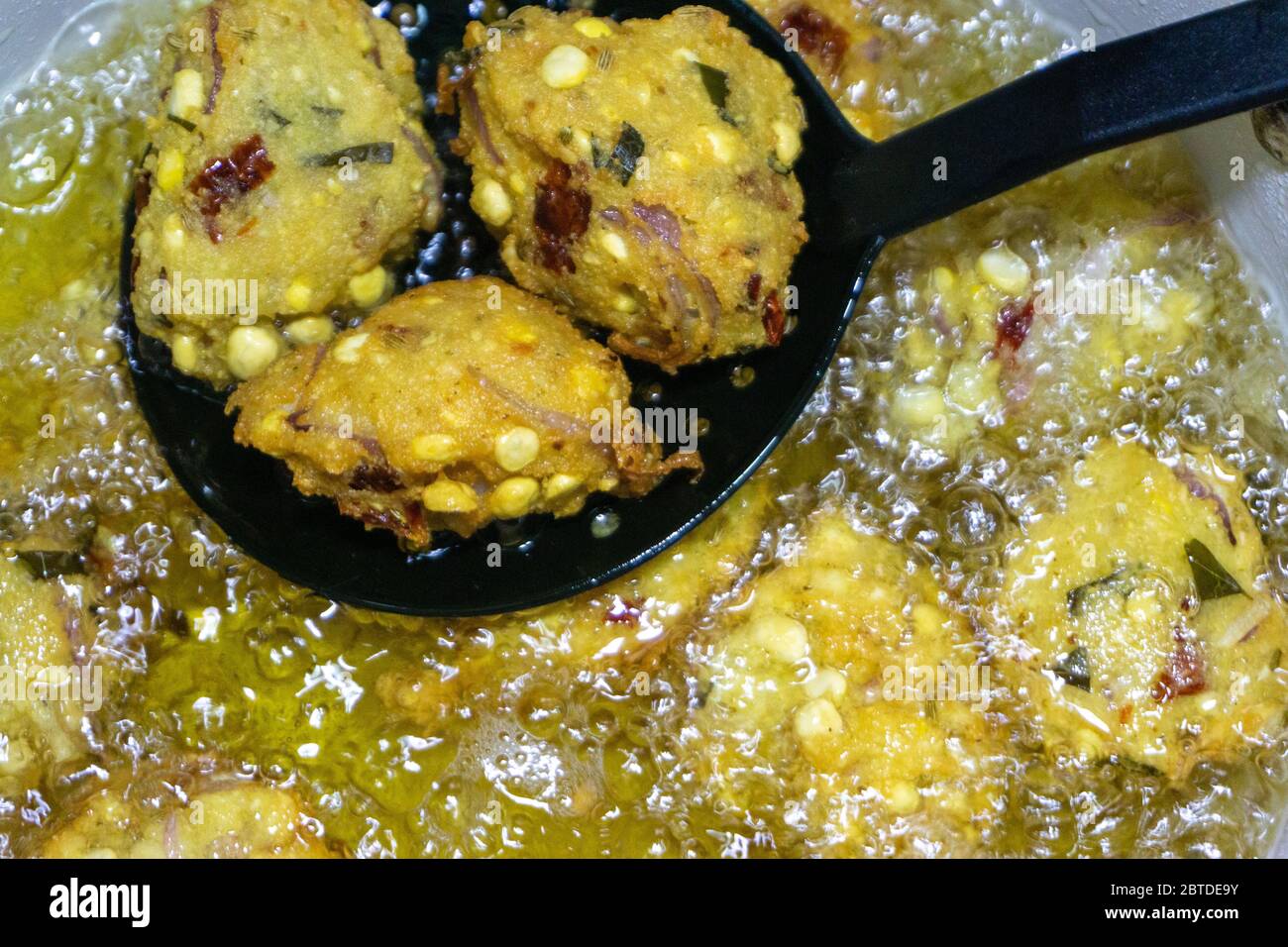 Fried cook of Batate Vade, Batate Vadey, Fried Dhal Beans Cake or Kuih ...
