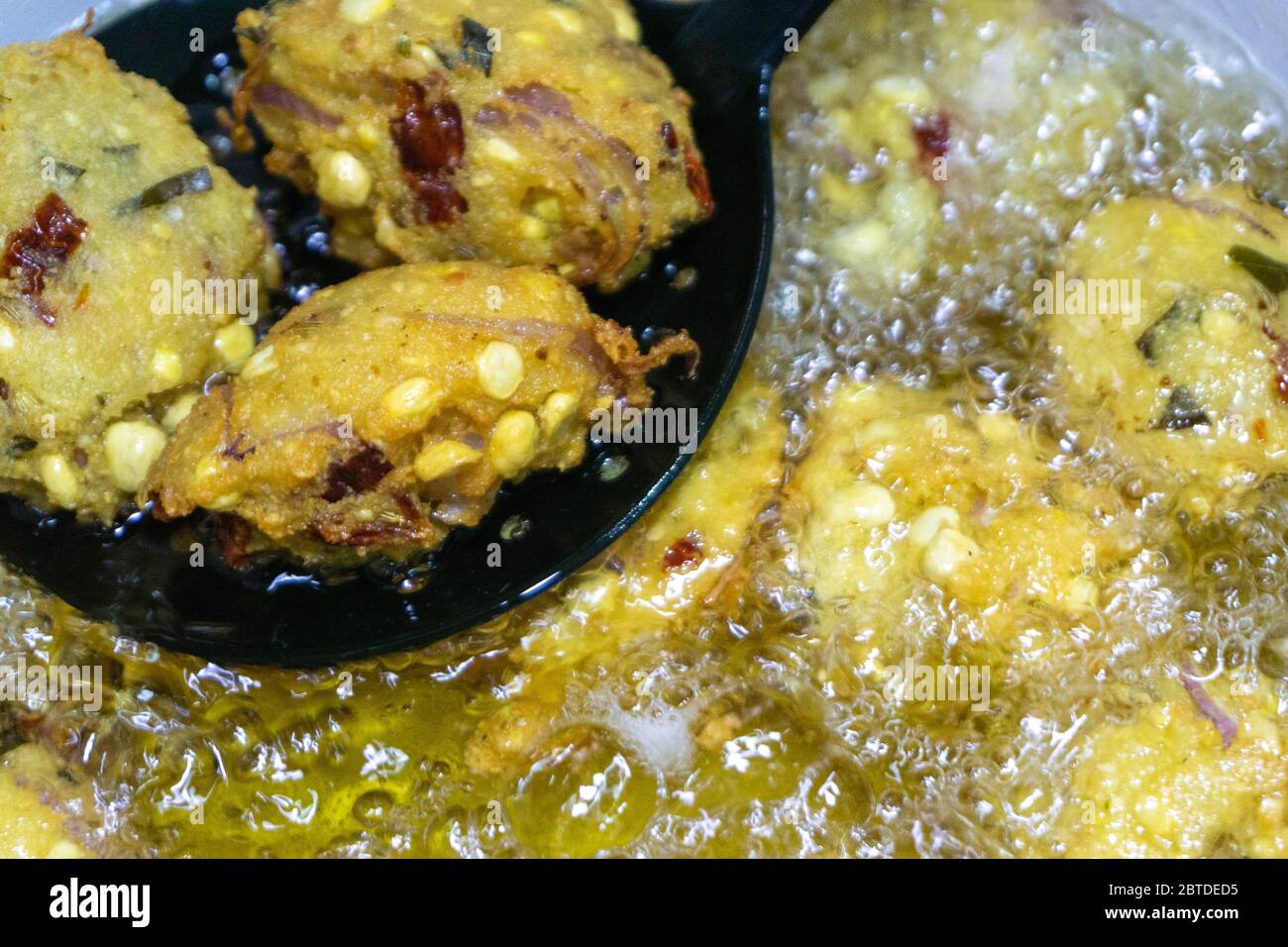 Fried cook of Batate Vade, Batate Vadey, Fried Dhal Beans Cake or Kuih ...