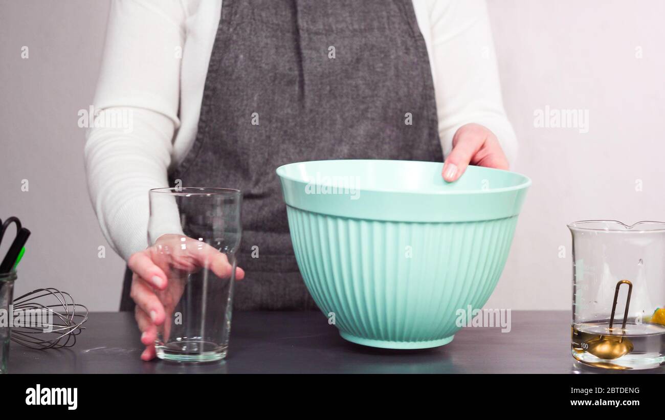 Step by step. Pouring royal icing into the piping bag to decorate sugar ...