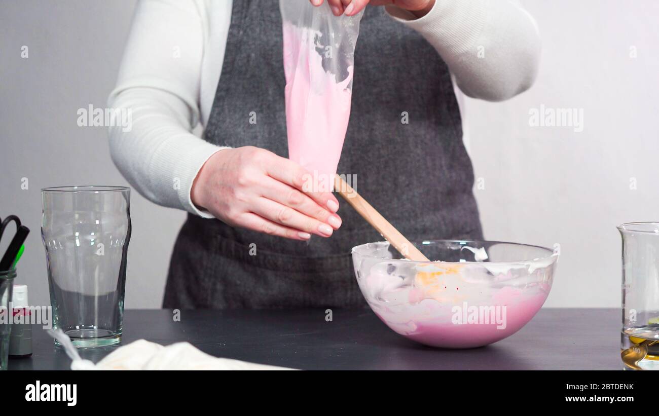 Step by step. Pouring royal icing into the piping bag to decorate sugar ...