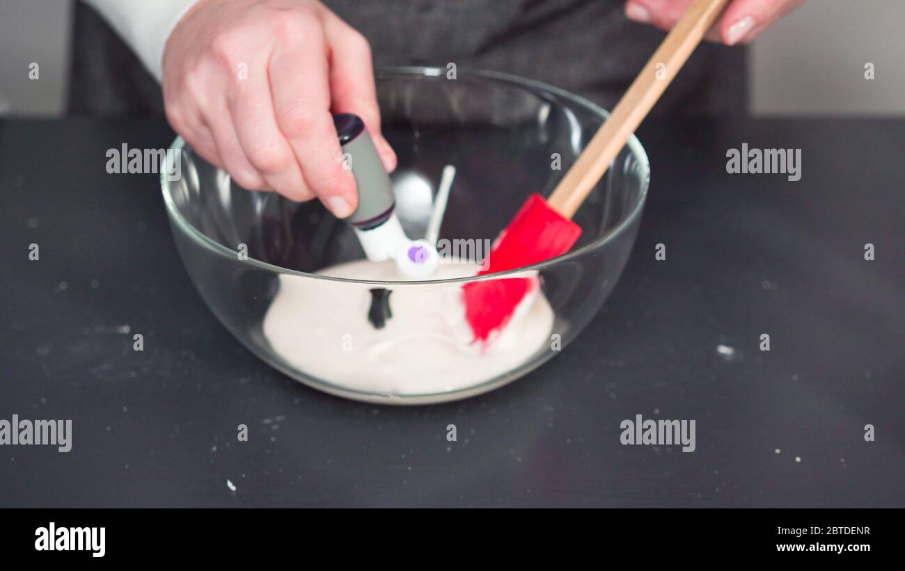 Step by step. Mixing in food coloring into the royal icing to decorate ...