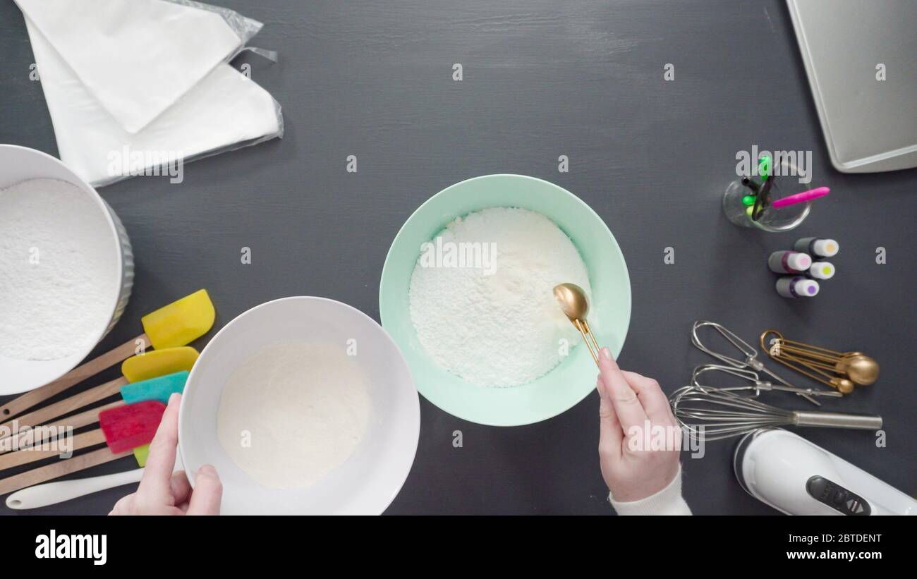 Step by step. Flat lay. Preparing simple royal icing to decorate sugar ...