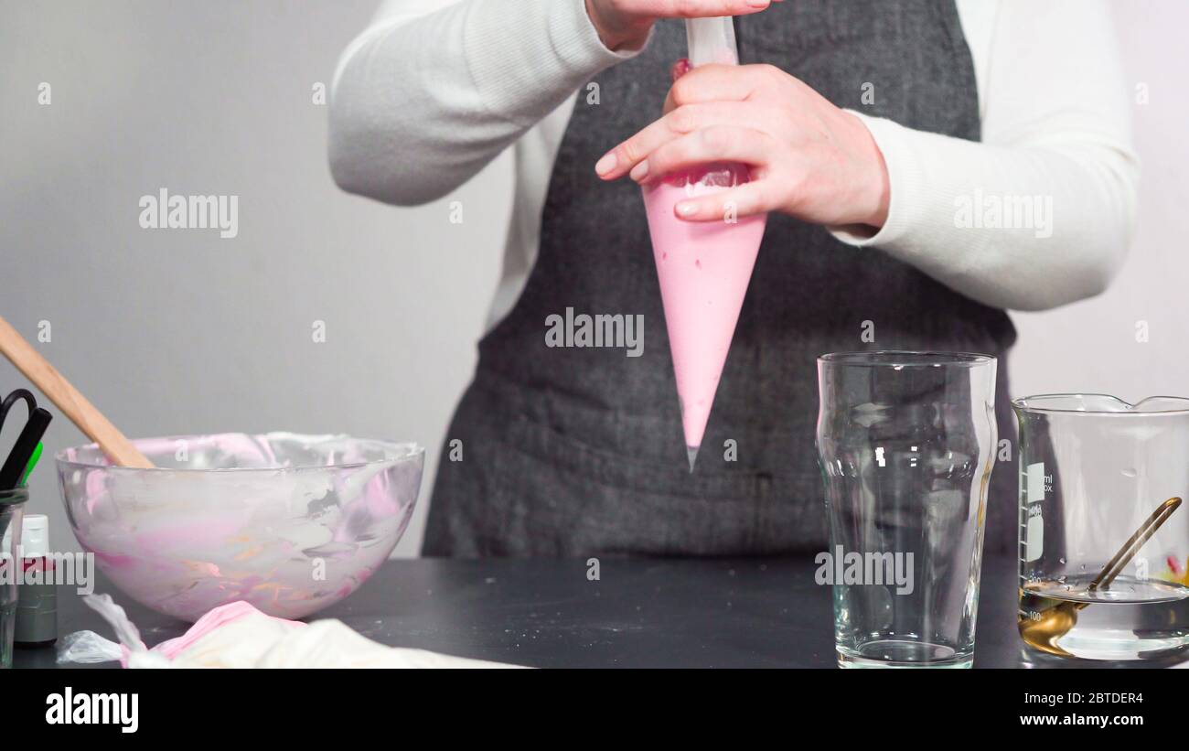 Step by step. Pouring royal icing into the piping bag to decorate sugar ...