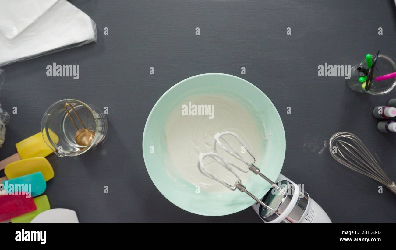 Step by step. Flat lay. Preparing simple royal icing to decorate sugar ...