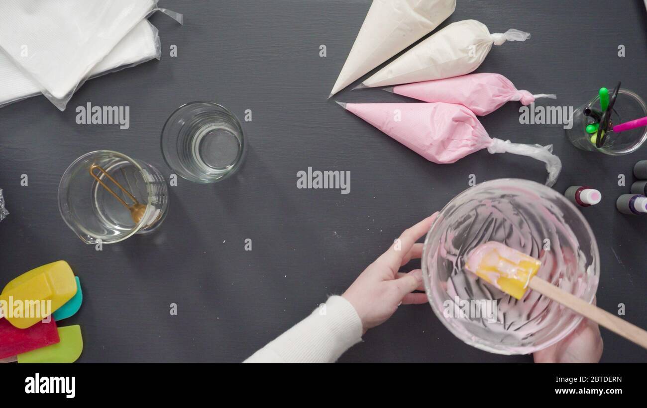 Step by step. Flat lay. Pouring royal icing into the piping bag to ...