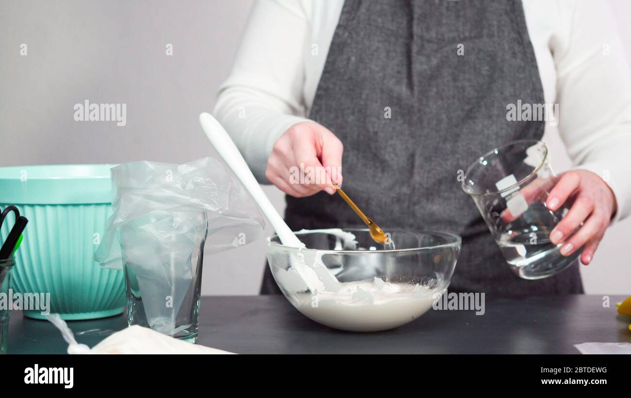 Step by step. Mixing in food coloring into the royal icing to decorate ...