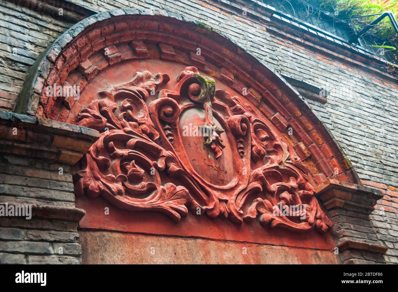 A brick arch feature on a shikumen building in an alleyway in Shanghai ...