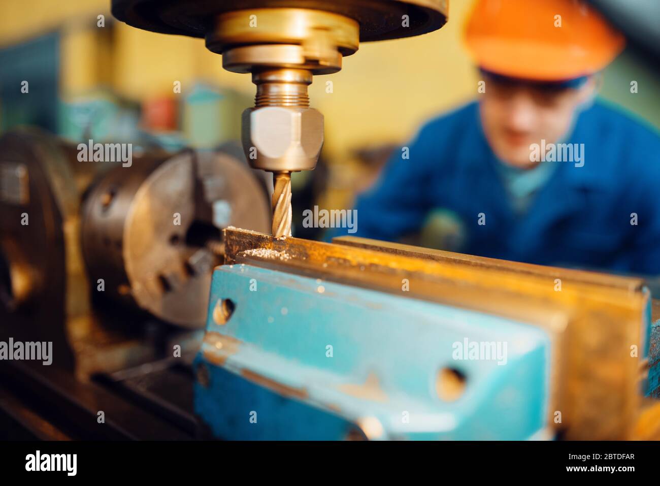 Male worker works on lathe closeup view, plant Stock Photo - Alamy