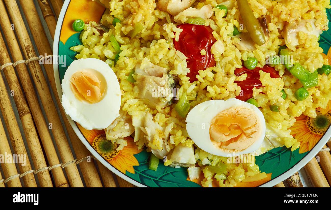 Smoked Spanish paprika paella with cod close up Stock Photo - Alamy